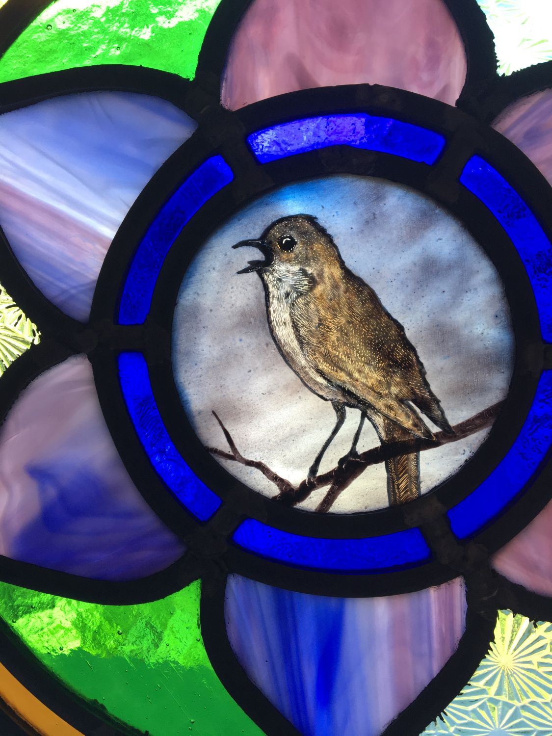 stained glass panel with nightingale